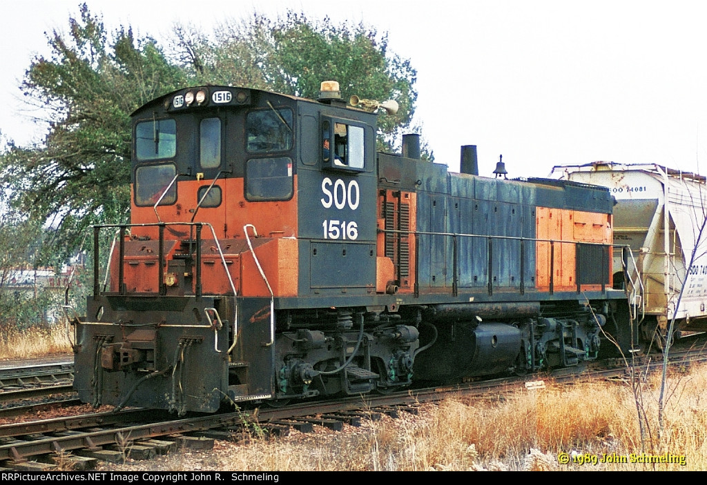 SOO 1516 (ex MILW MP15AC) a Soo Line "Bandit" MP15AC switches at Mason City IA. 11/19/1989 ...